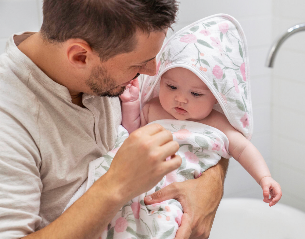 Baby Spit Up: Causes, When It Stops & When to Worry | aden + anais